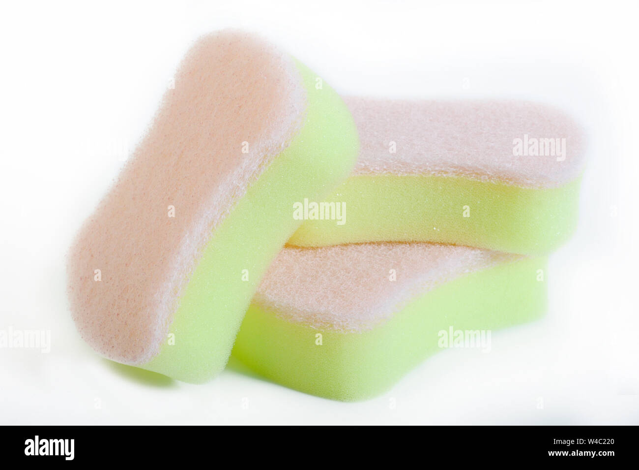 sponge for washing dishes on white background Stock Photo - Alamy