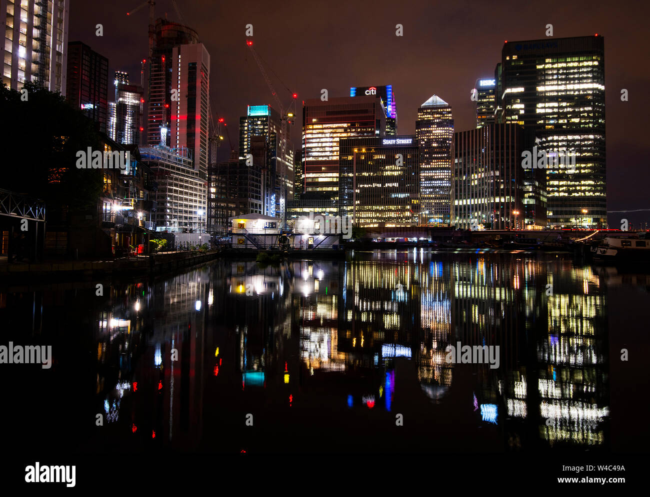 Canary Wharf at night, captured from the Blackwall Basin in London ...
