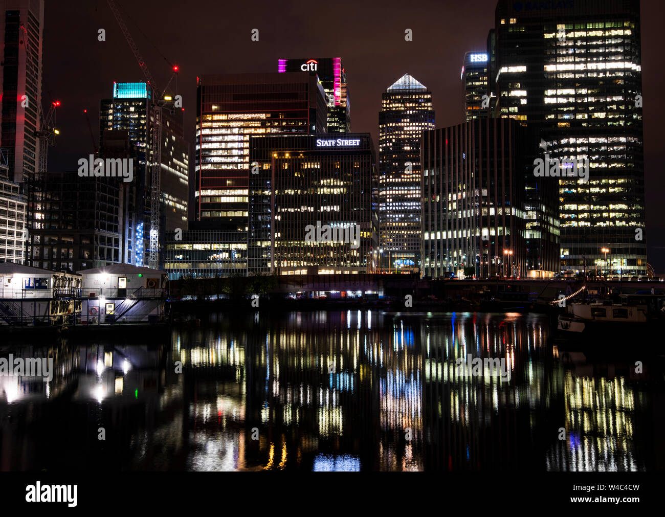 Canary Wharf at night, captured from the Blackwall Basin in London ...