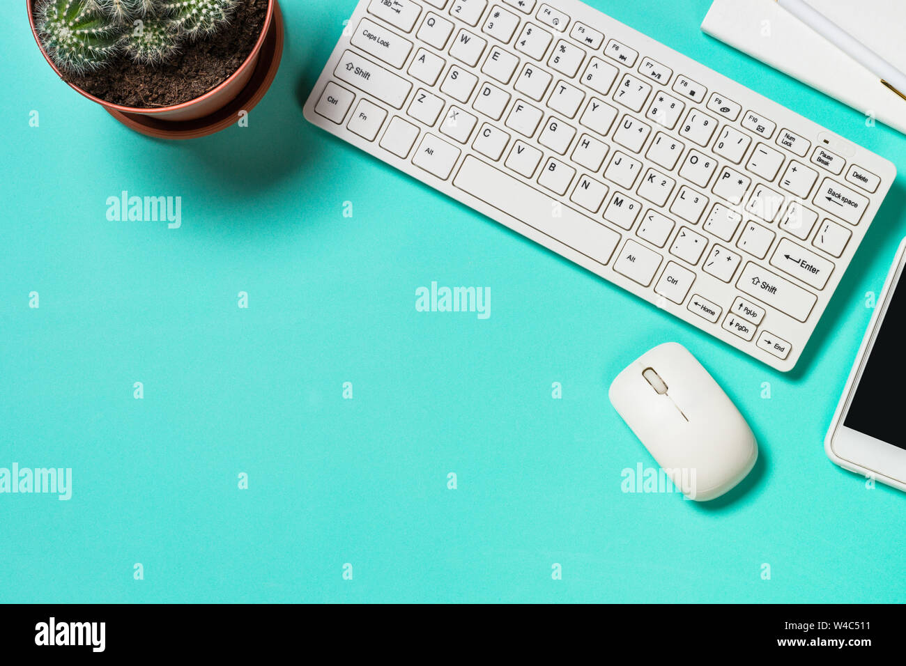 Office workplace with keyboard, notepad, succulent and pen Stock Photo ...