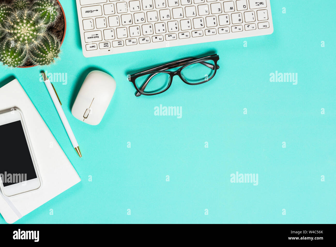 Office workplace with keyboard, notepad, succulent and pen Stock Photo ...