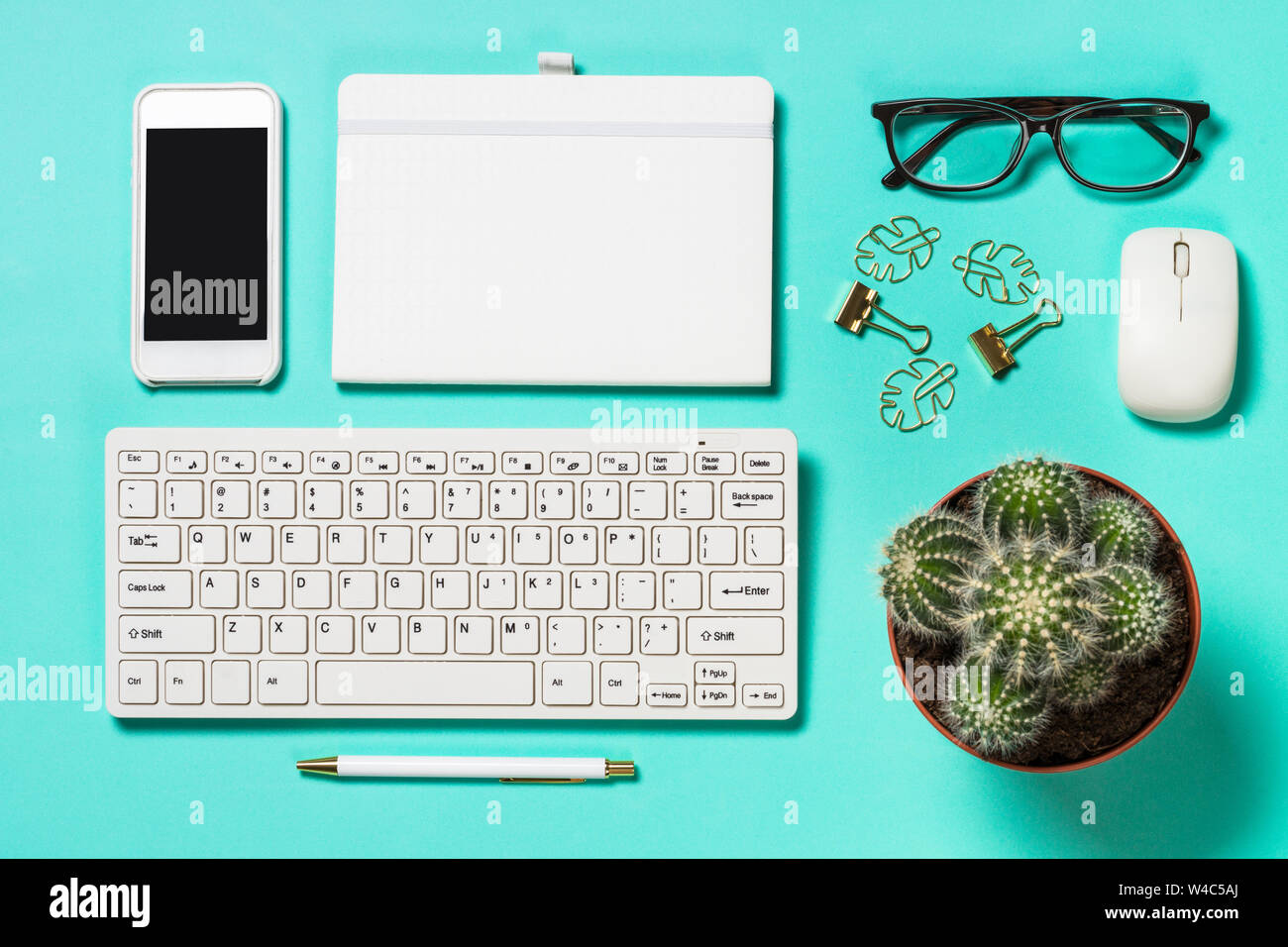 Office workplace with keyboard, notepad, succulent and pen Stock Photo ...