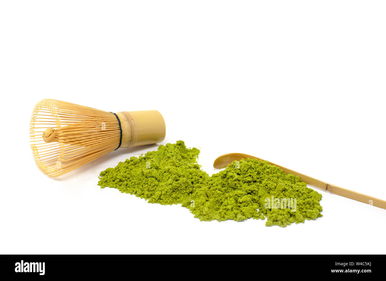 Matcha tea powder, on white background Stock Photo - Alamy