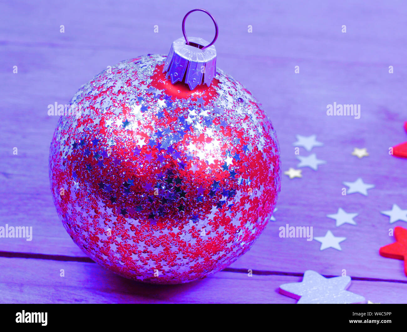 Red Christmas ball with stars Stock Photo - Alamy