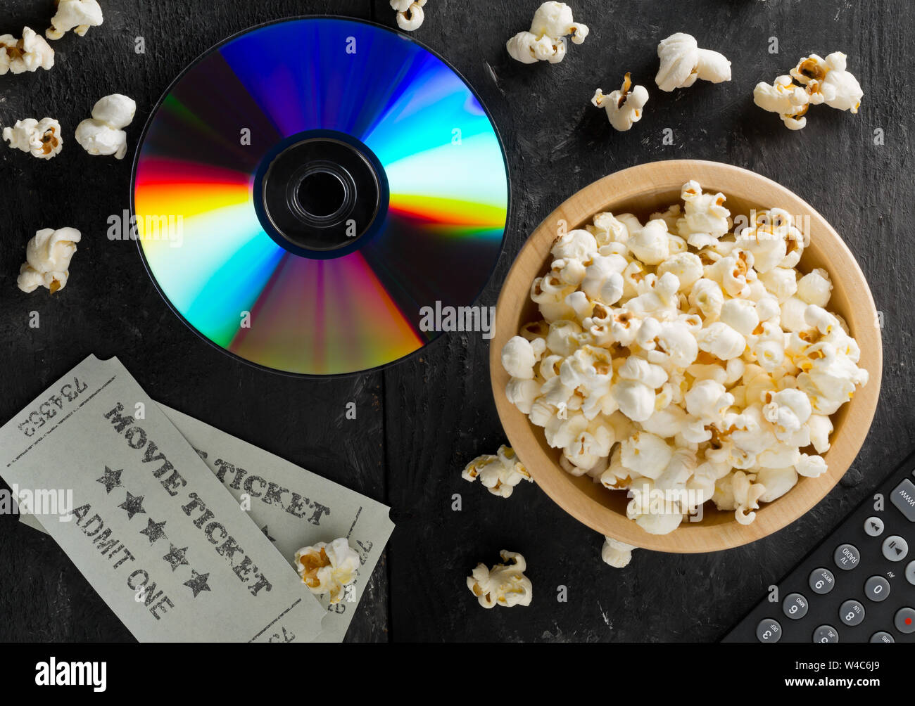 DVD or blu ray movie disc with tv remote control, movie tickets and ...