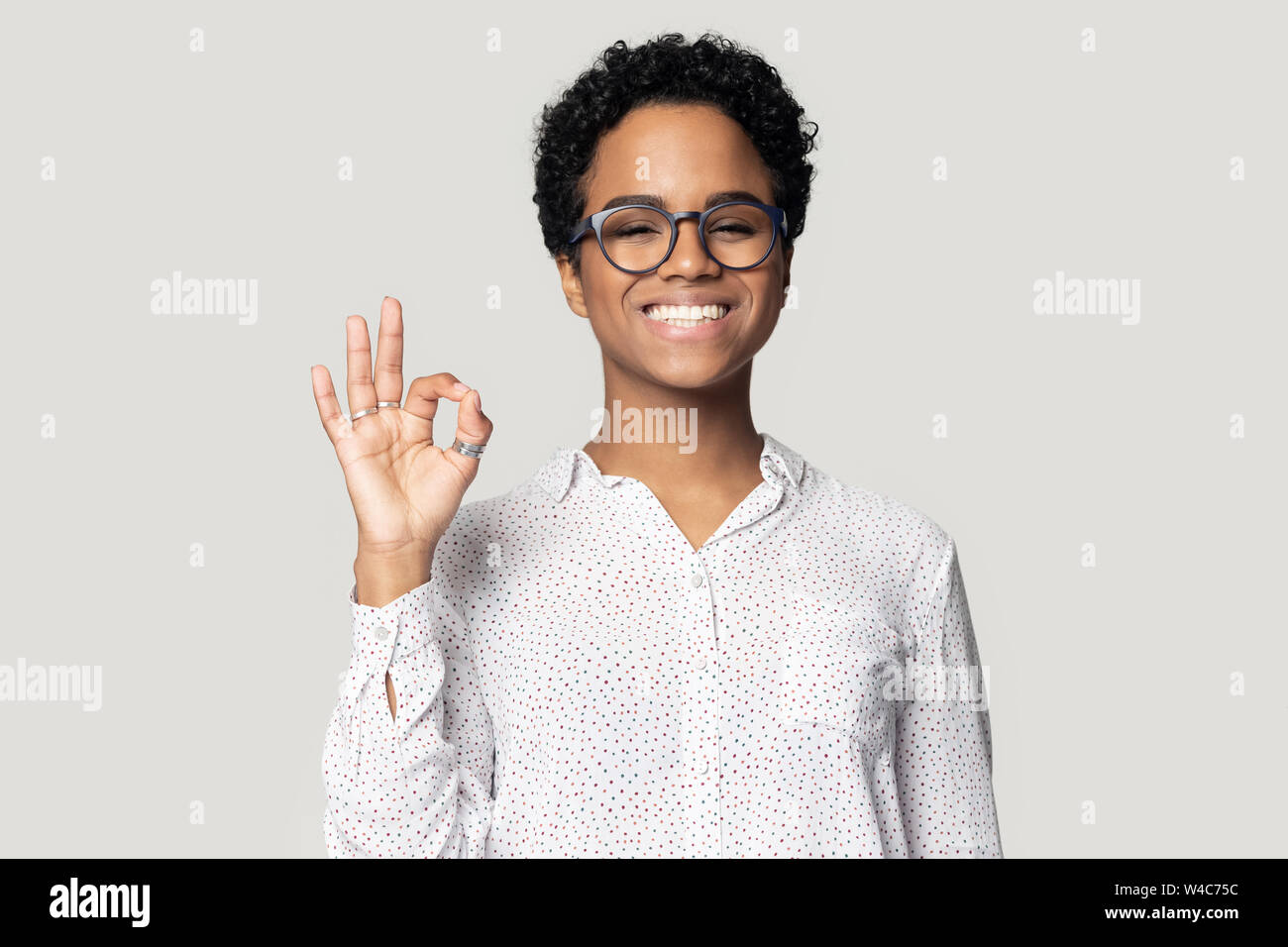 Happy biracial girl show all right sign recommending service Stock ...