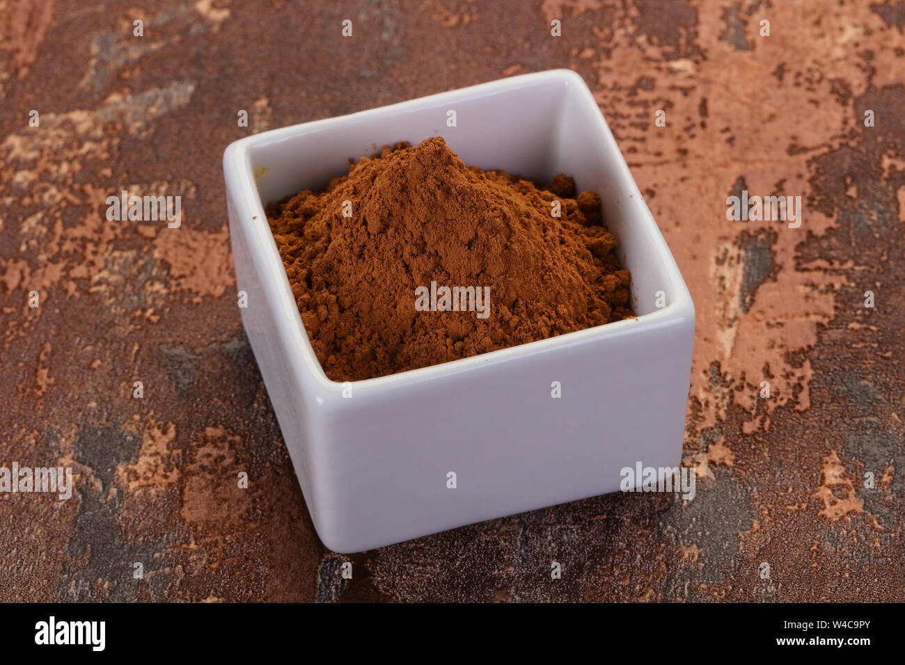 Cocoa powder in the bowl - ready for cooking Stock Photo - Alamy