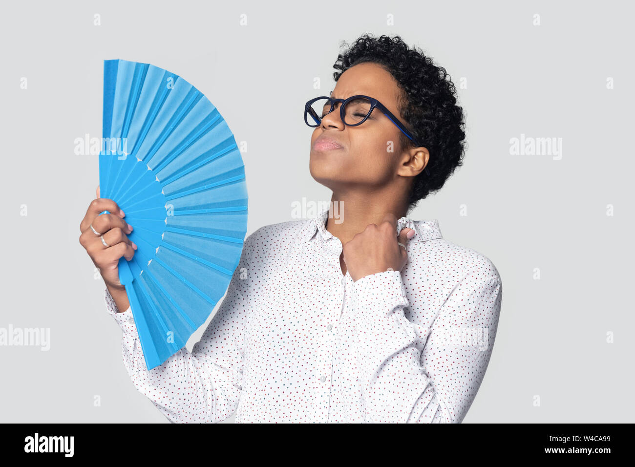 Heat hand fan face hi-res stock photography and images - Alamy