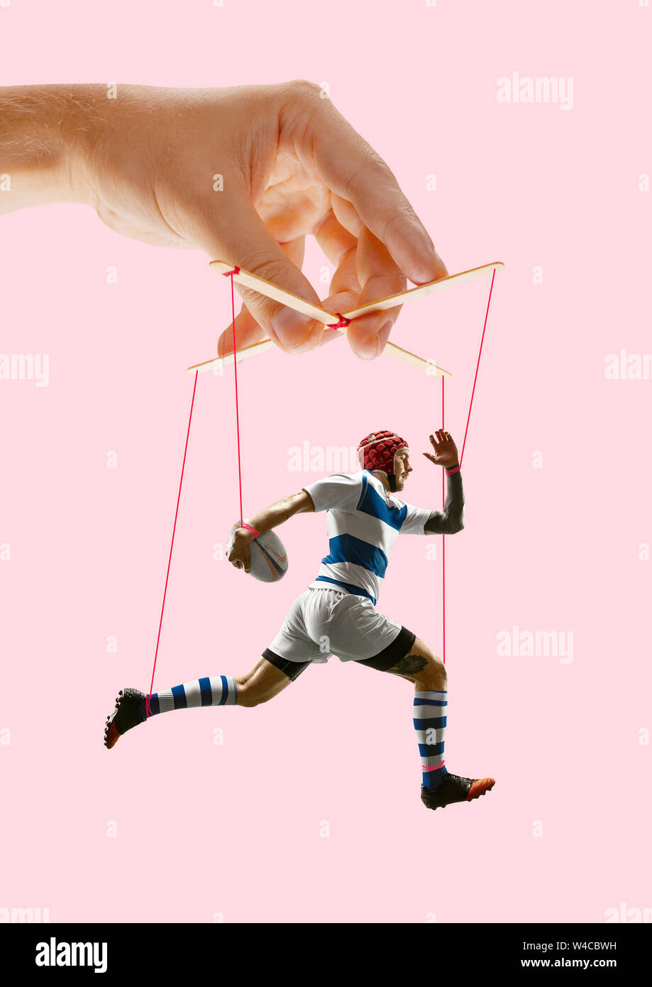 Man like a puppet in somebodies hands on coral background. Concept of ...