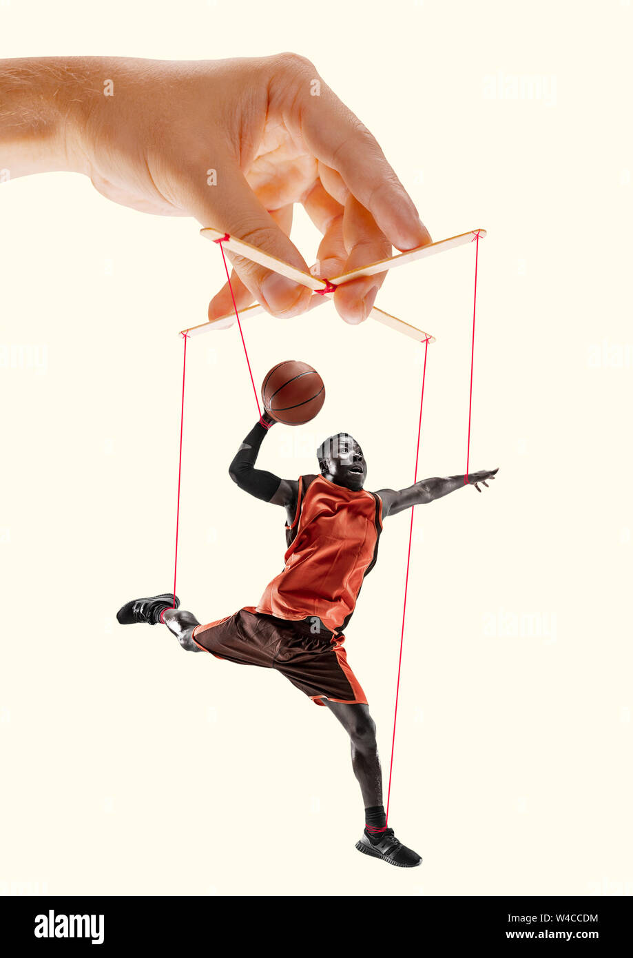 Man like a puppet in somebodies hands on yellowbackground. Concept of ...