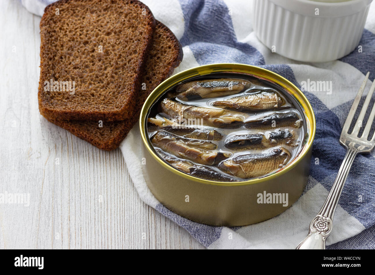 Canned sprats in tin can with bread for sandwich Stock Photo - Alamy