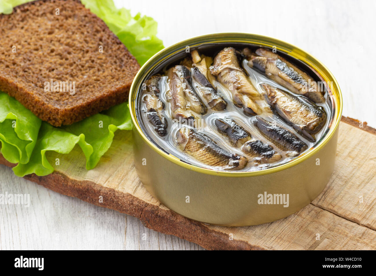 Canned sprats in tin can with bread for sandwich Stock Photo - Alamy