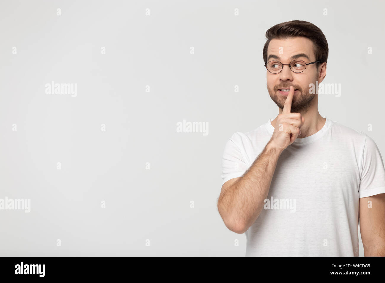 Quiet gesture hi-res stock photography and images - Alamy