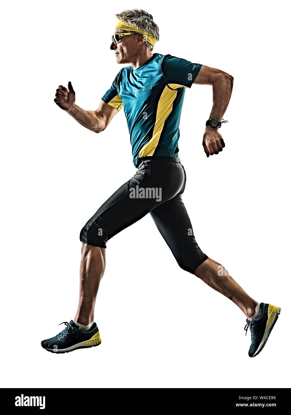 one caucasian senior man running runner jogger jogging in studio shadow ...