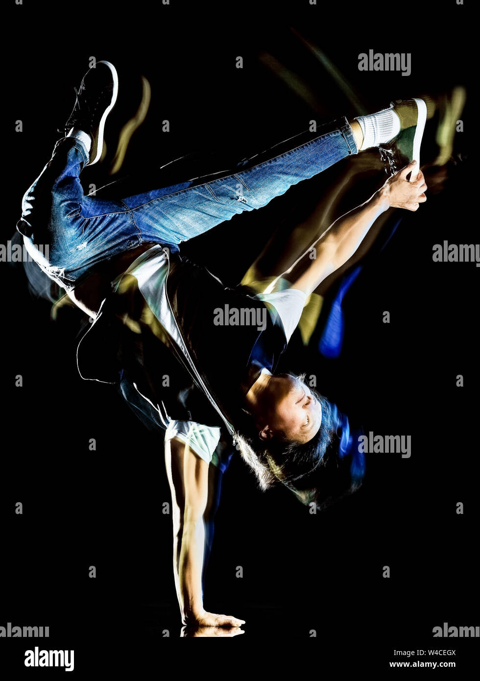 one chinese young man hip hop break dancer dancing isolated on black ...
