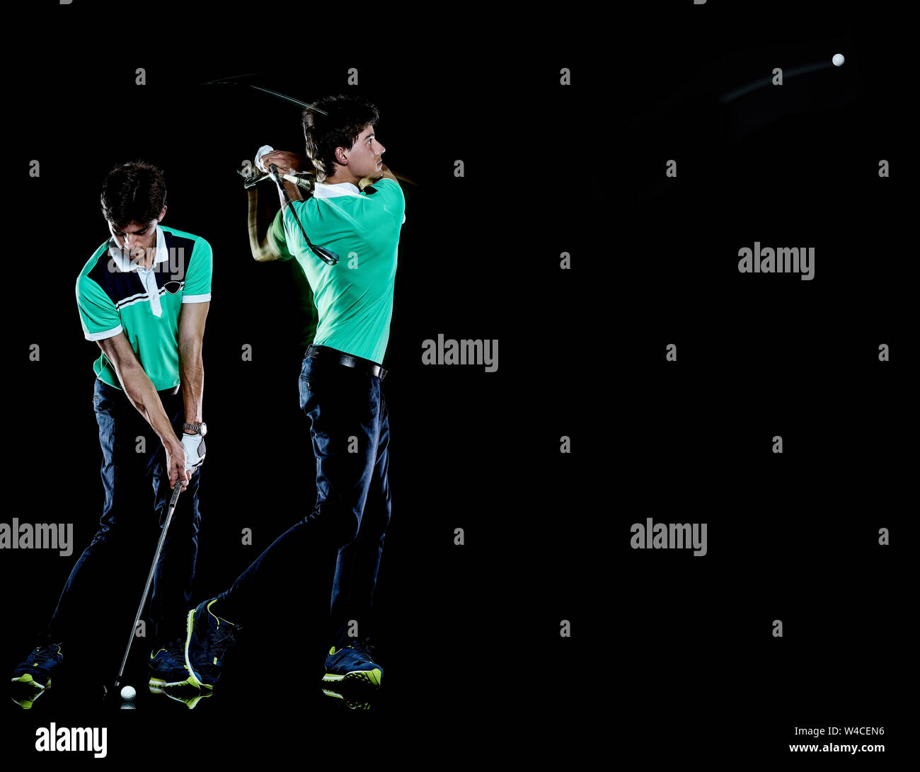 one caucasian young golfer man golfing golf swing isolated on black ...