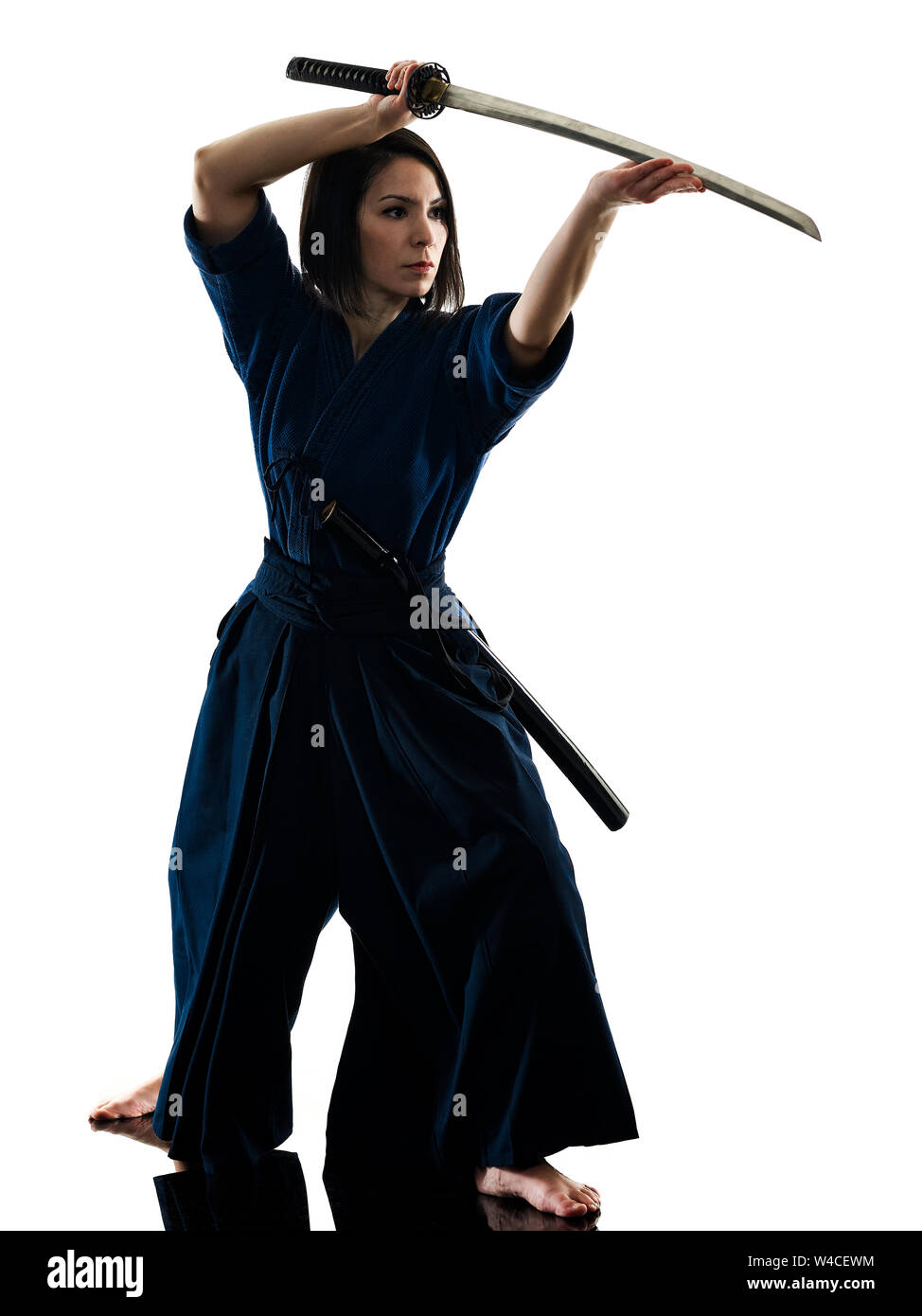 one caucasian woman practicing laido Katori Shinto ryu shadow ...