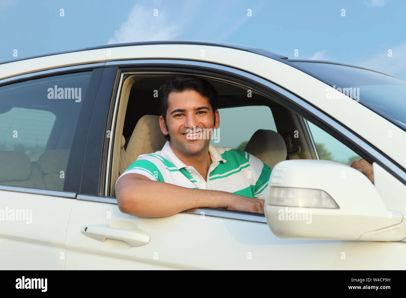 Portrait of a man driving a car Stock Photo - Alamy
