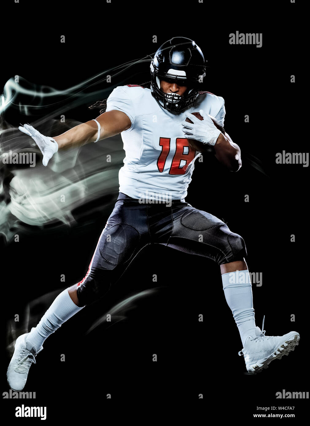 one african american football player man studio shot isolated on black ...