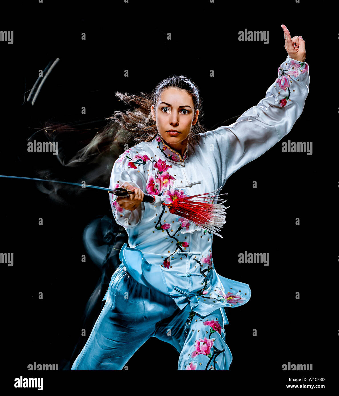 one chinese woman partacticing Tai Chi Chuan Tadjiquan posture studio ...