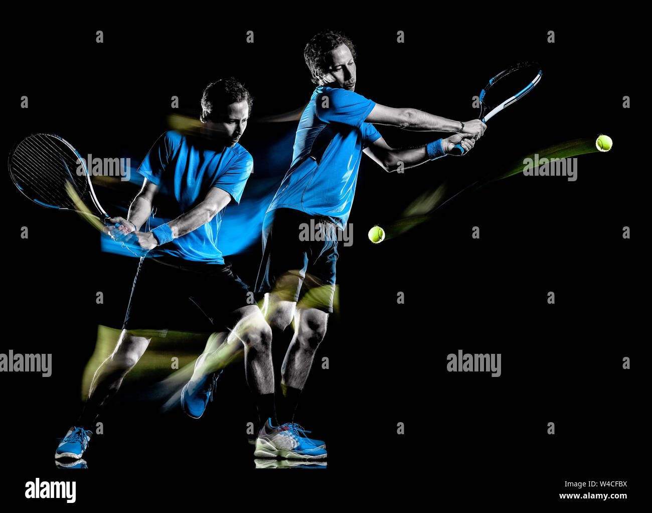 one caucasian tennis player man isolated black background in light ...