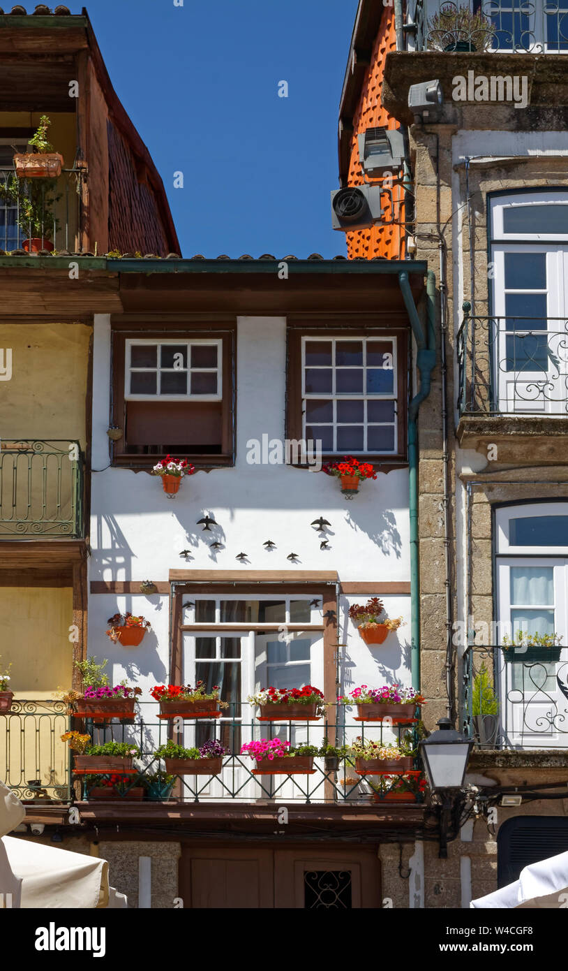 narrow row house, planters, flowers, Largo da Oliveira, plaza, gothic ...