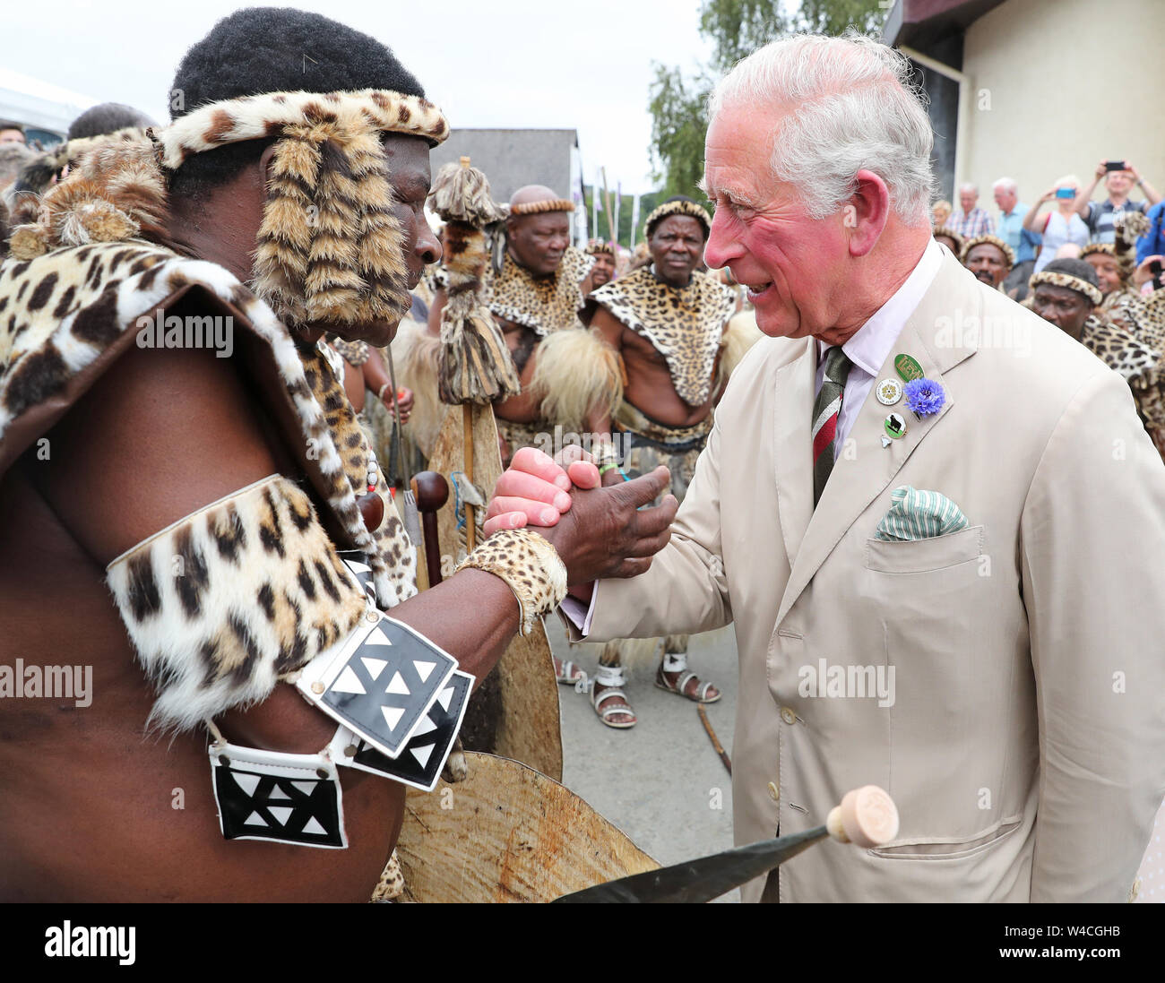 The Prince of Wales meets members of the Zulu 'impi' regiment during ...