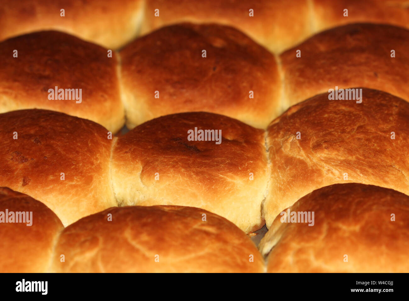 Buns baking in oven. Food background Stock Photo - Alamy
