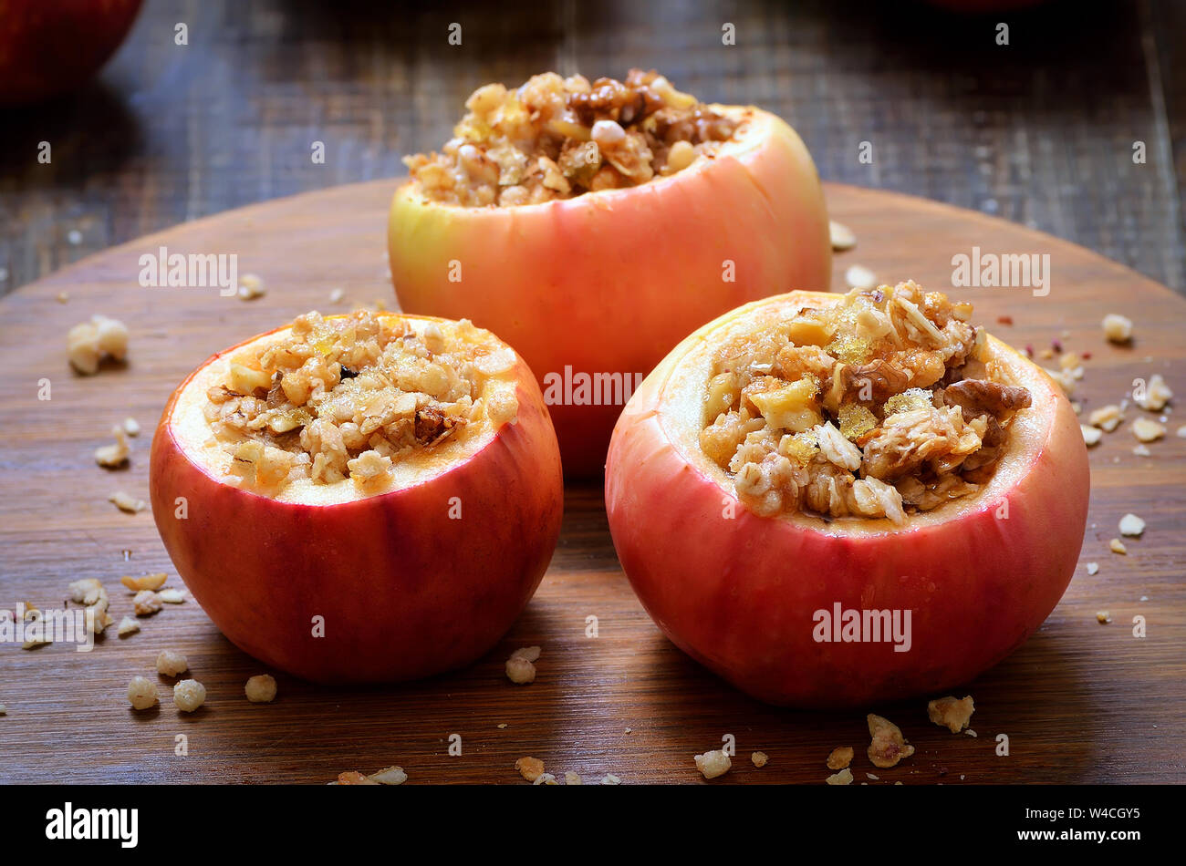 Appetizer baked stuffed apples on wooden table Stock Photo - Alamy