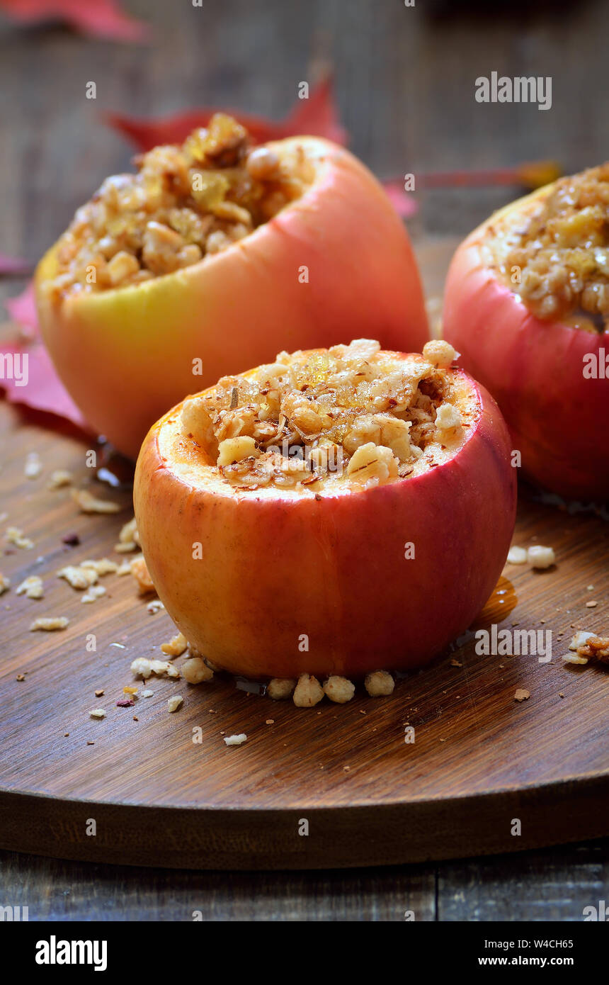 Appetizer baked stuffed apples on wooden table Stock Photo - Alamy