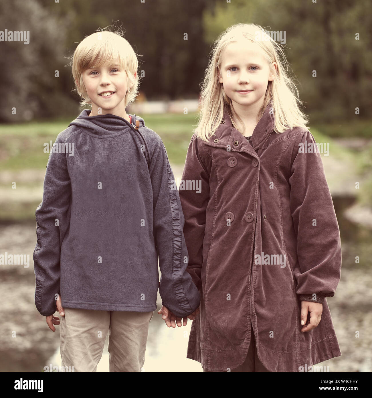 First love, romantic concept, little boy and girl holding hands Stock ...