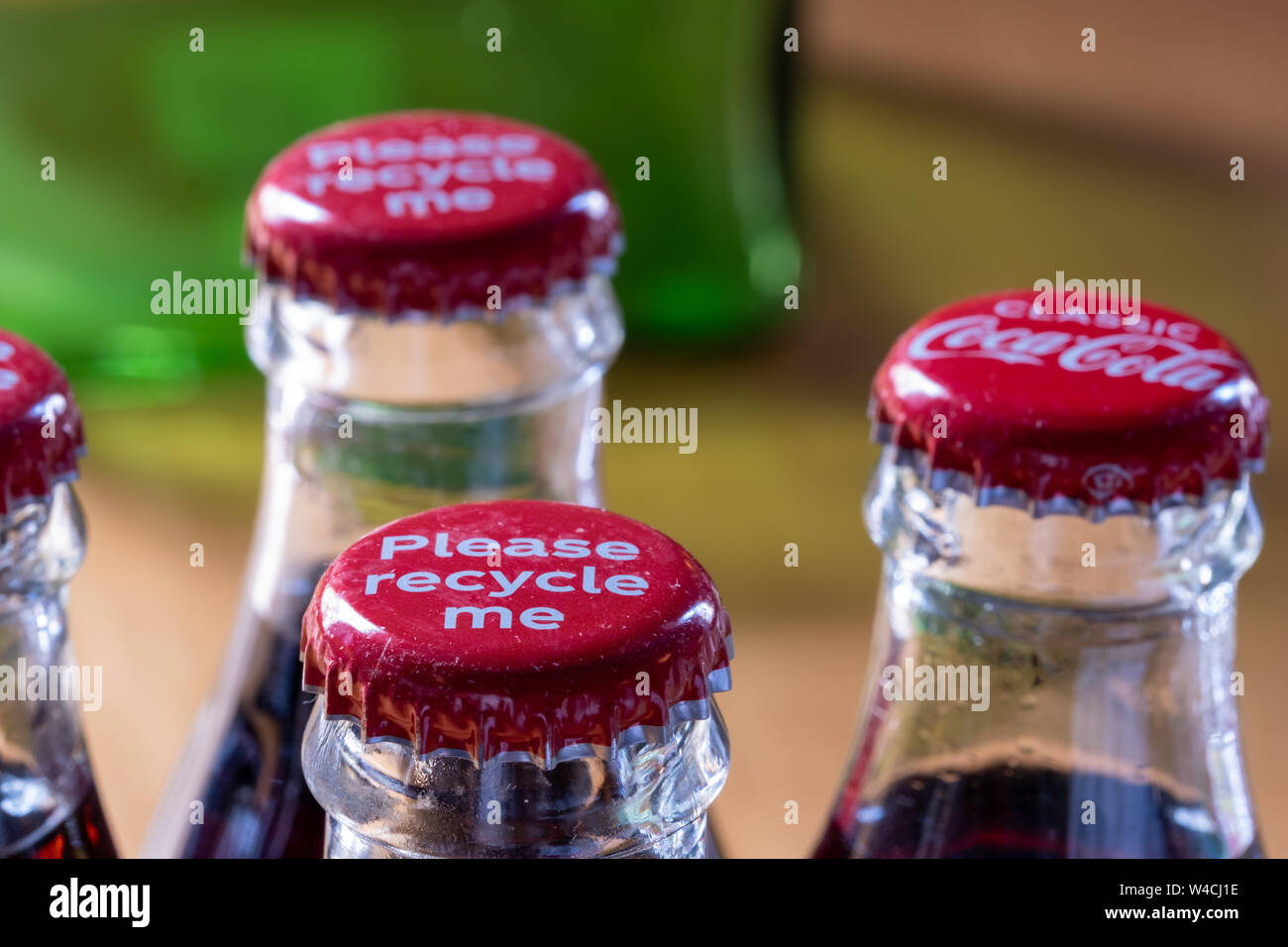 Red metals caps on the top of retro style glass coca cola bottles ...