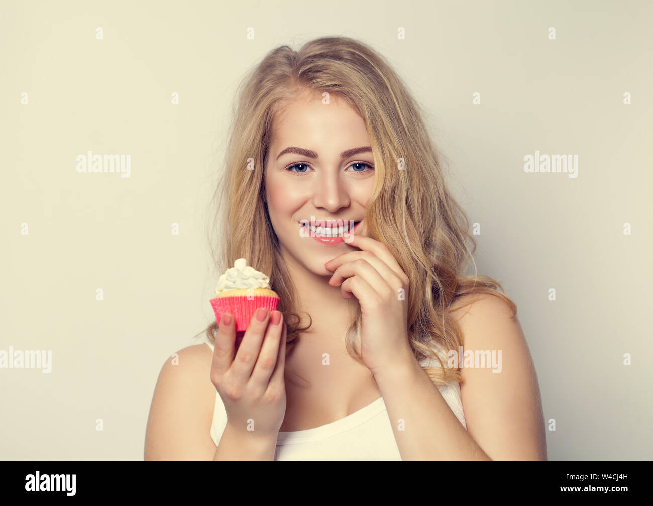Smiling Cute Girl holding Cake in her hands. Woman with Beautiful ...
