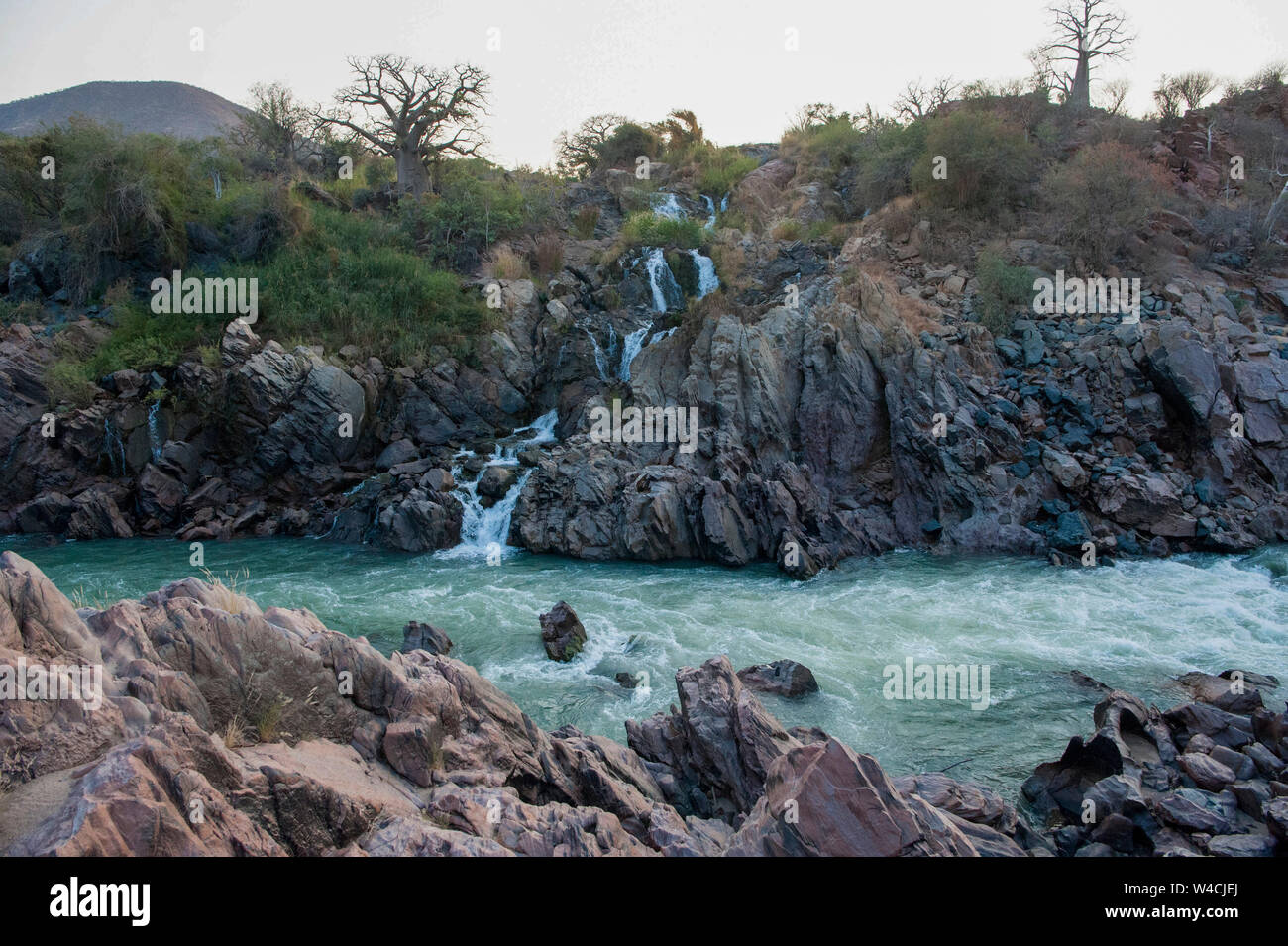 River rushing over jagged cliffs, Epupa falls Cunene River in Namibia ...