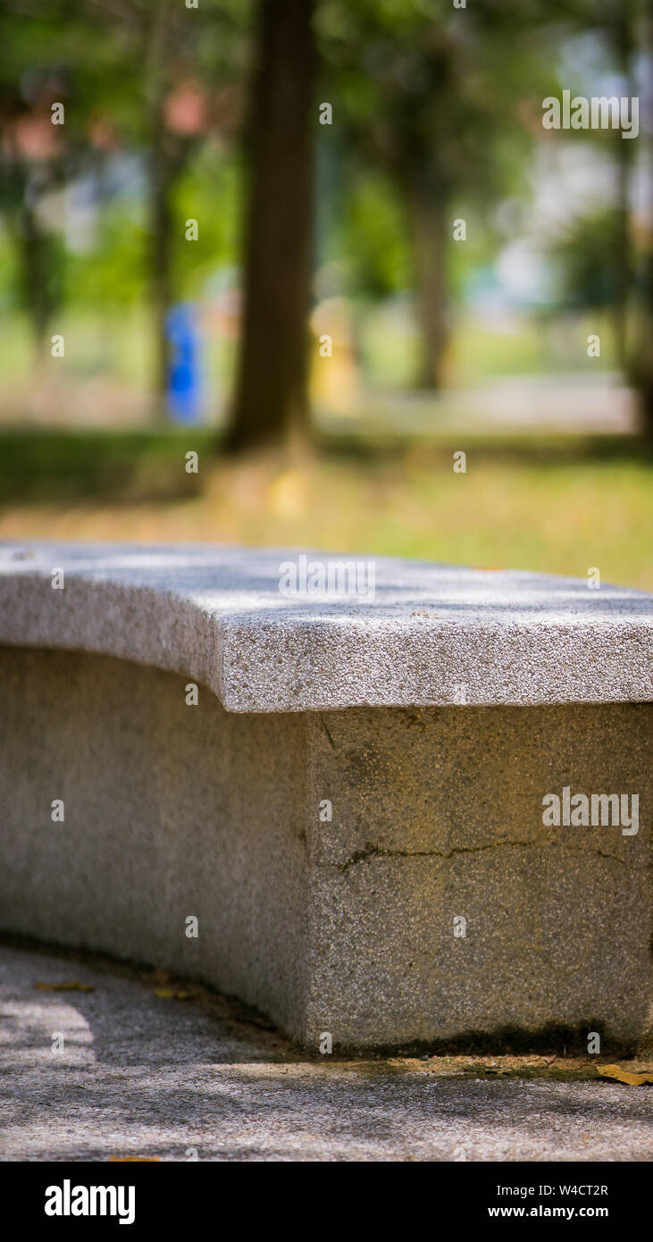 Stone bench covered with pebble wash in an outdoor park Stock Photo - Alamy