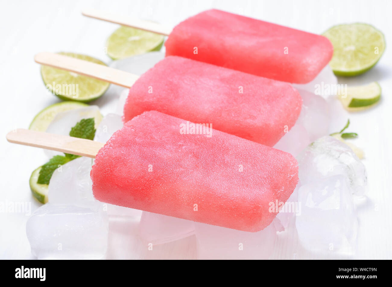 Popsicles from frozen watermelon on white table, close up Stock Photo ...