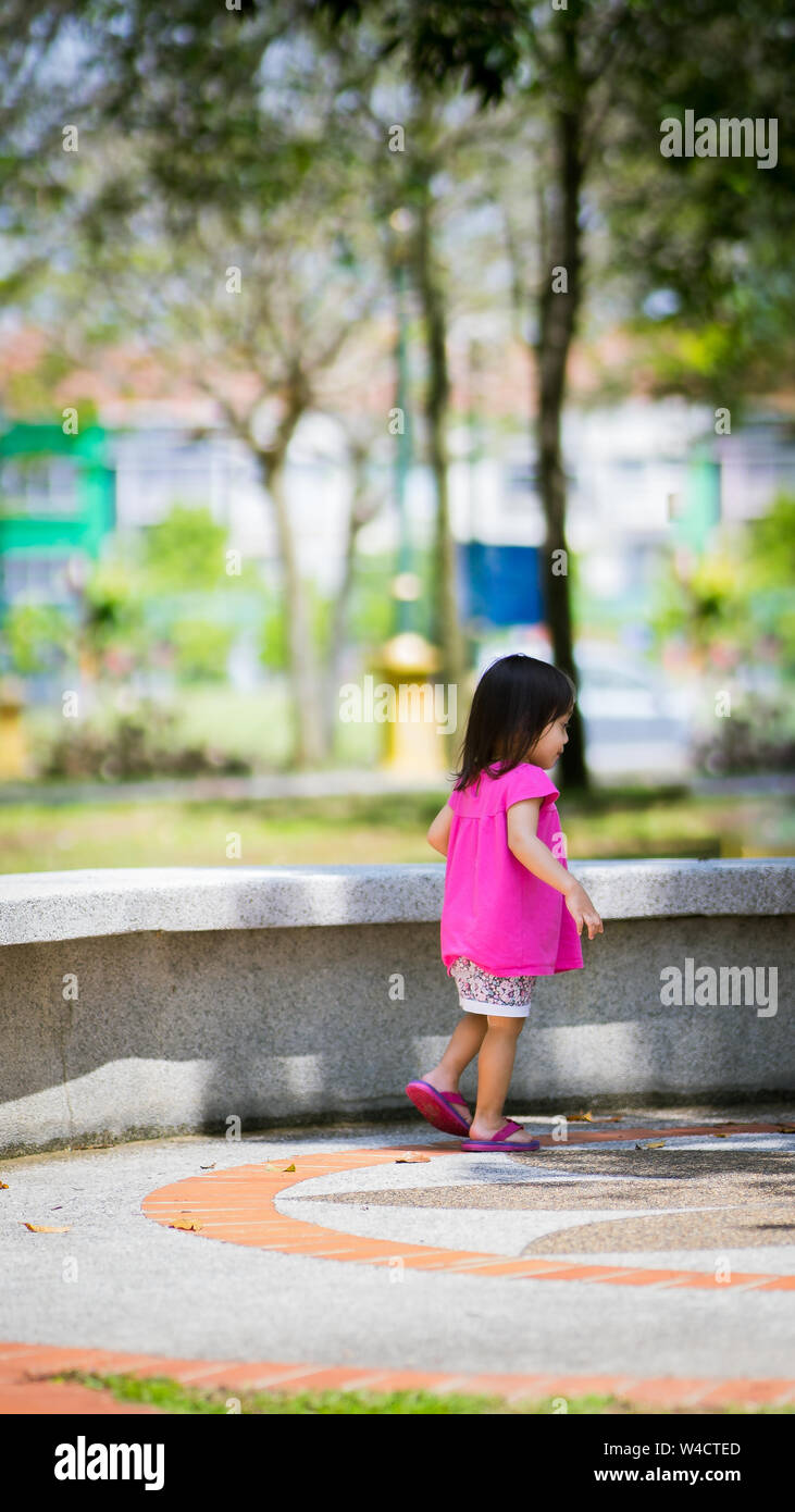 Little girl running behind little hi-res stock photography and images ...