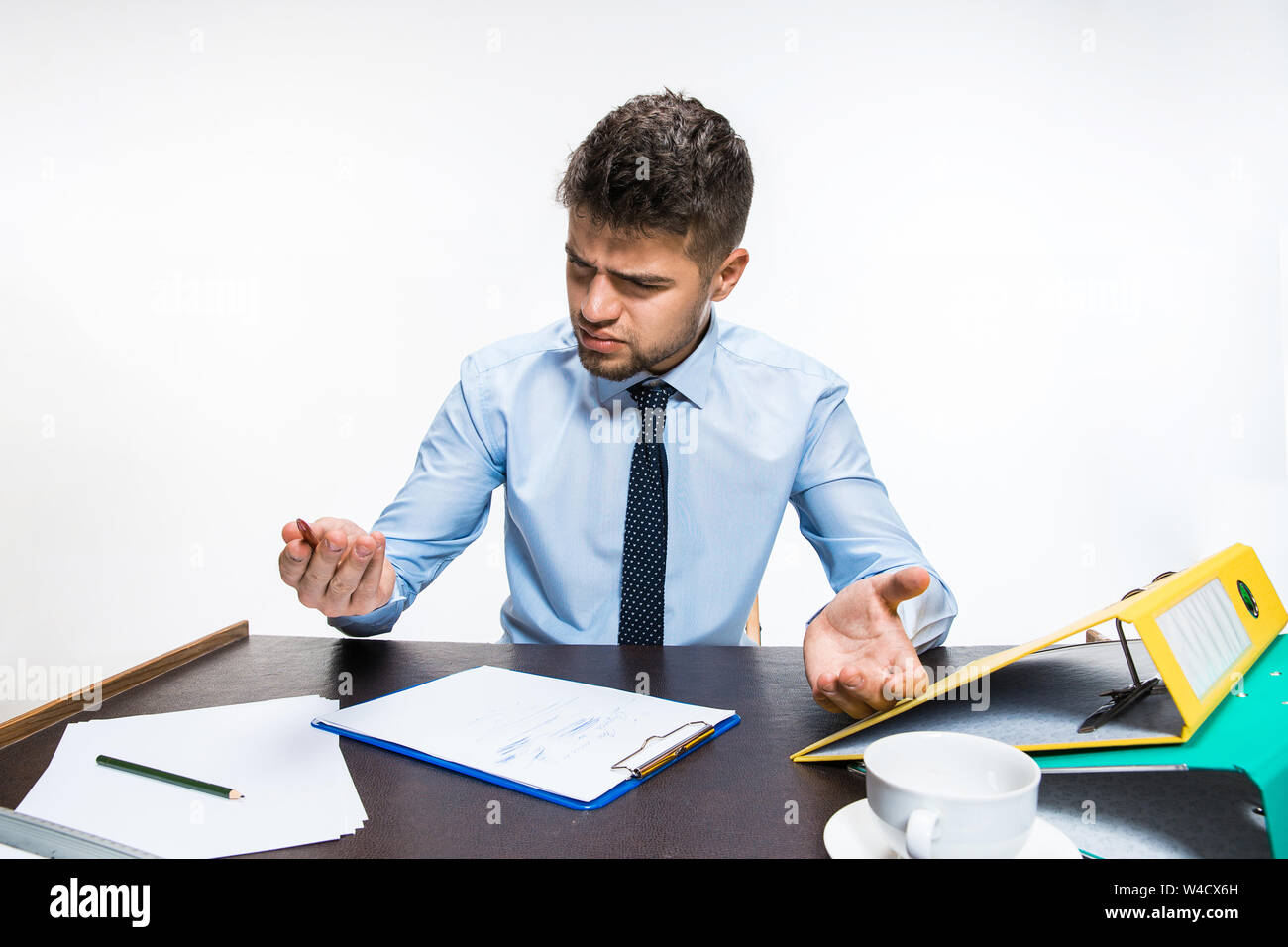 The ink in the pen ended abruptly and the man is forced to write in ...