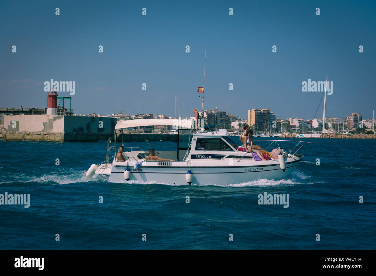 Woman on boat wearing bikini hi-res stock photography and images - Alamy