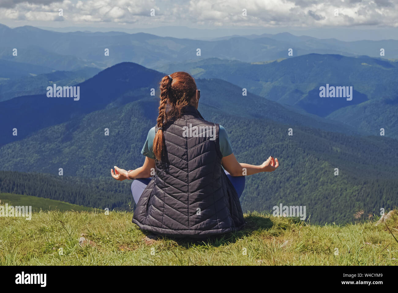 Person sitting back view meditating hi-res stock photography and images ...