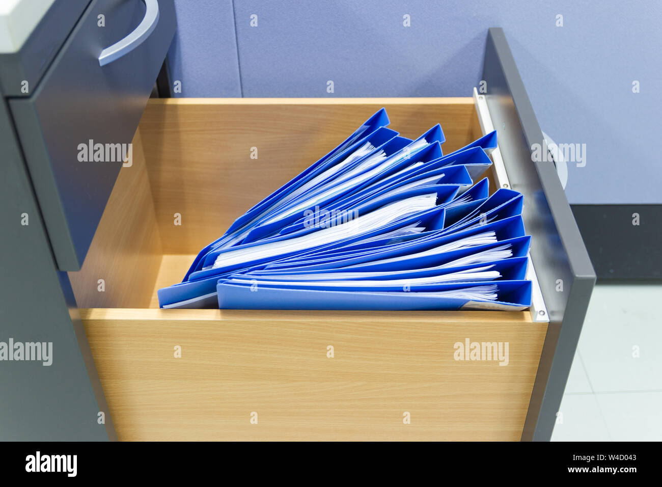 blue file folder documents In a file cabinet retention of contracts ...