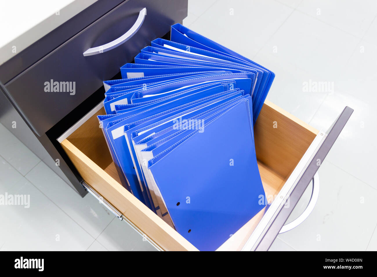 blue file folder documents In a file cabinet retention of contracts ...