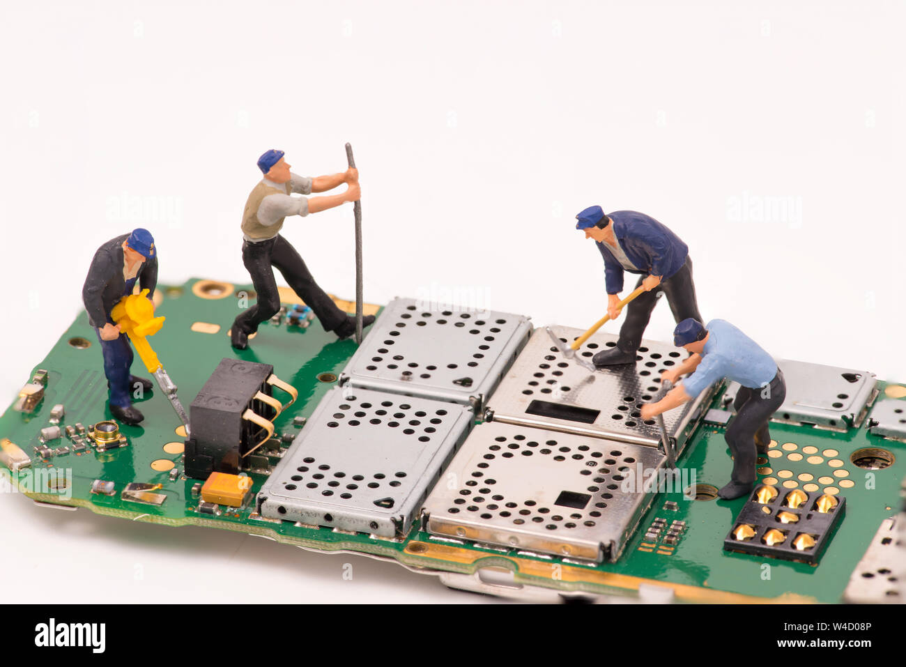 miniature people repair electronic device Stock Photo - Alamy