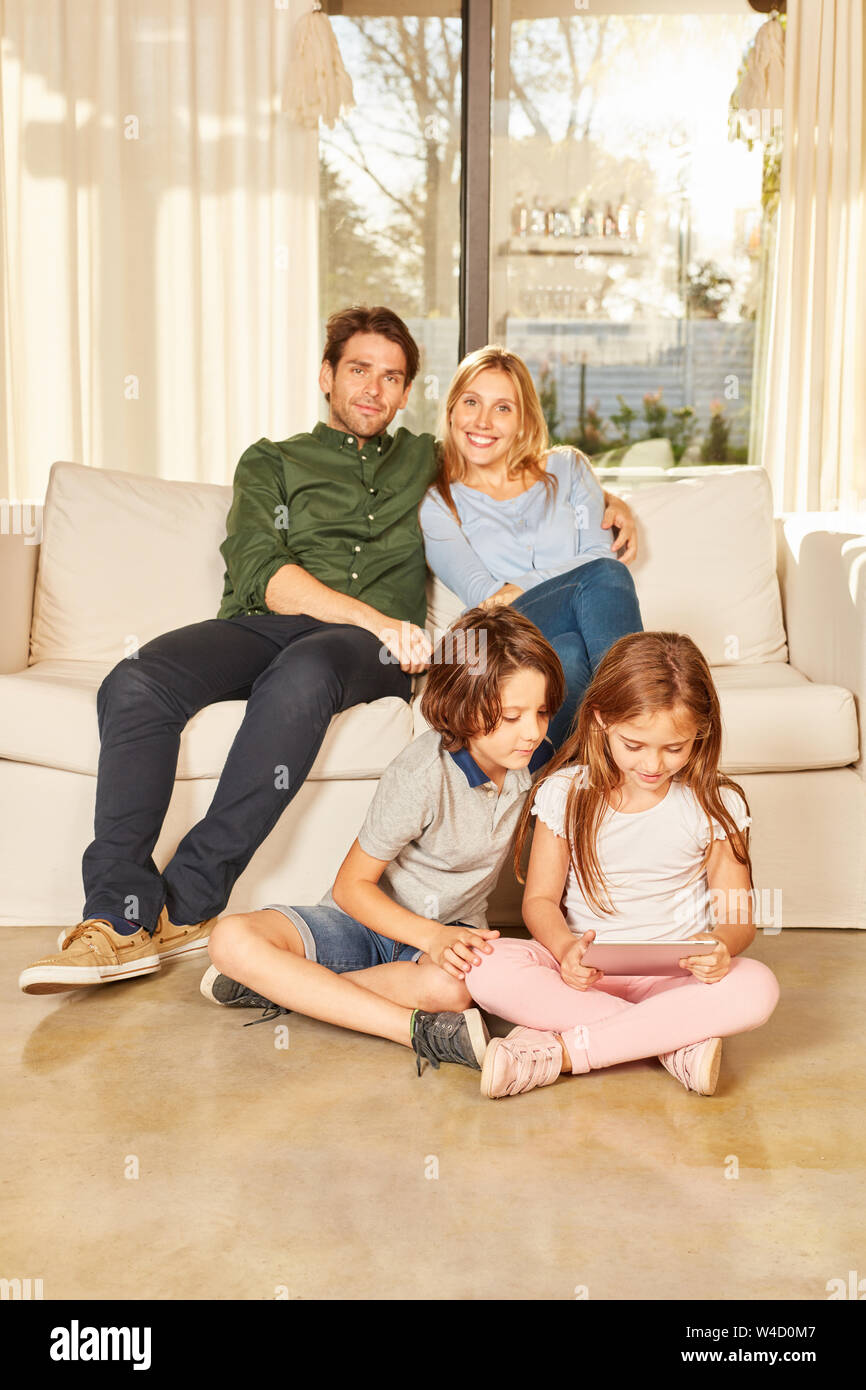 Parents watching kids on internet hi-res stock photography and images ...