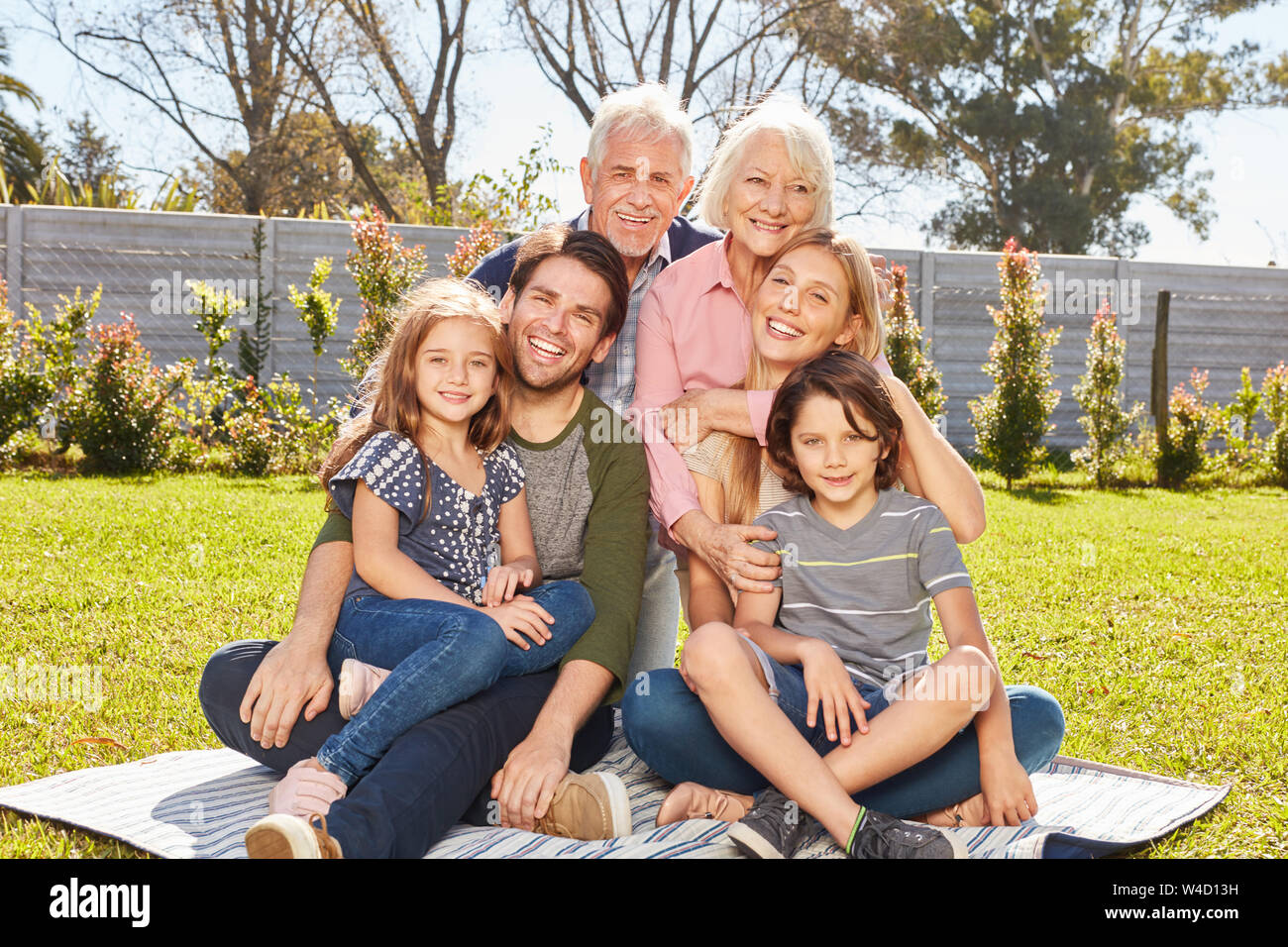 Happy family with three generations together in the summer in the ...