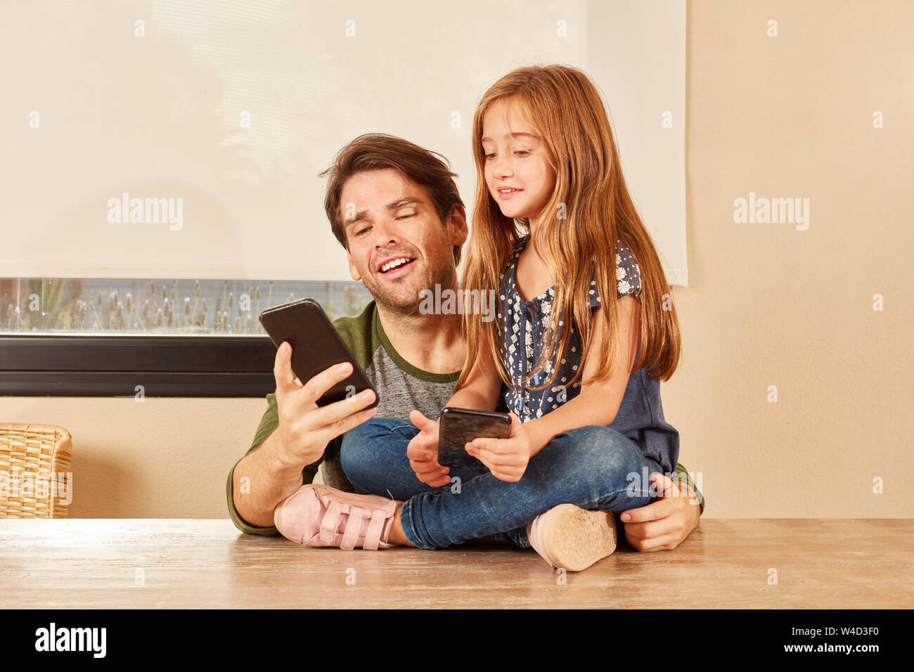 Father with young daughter using computer hi-res stock photography and ...