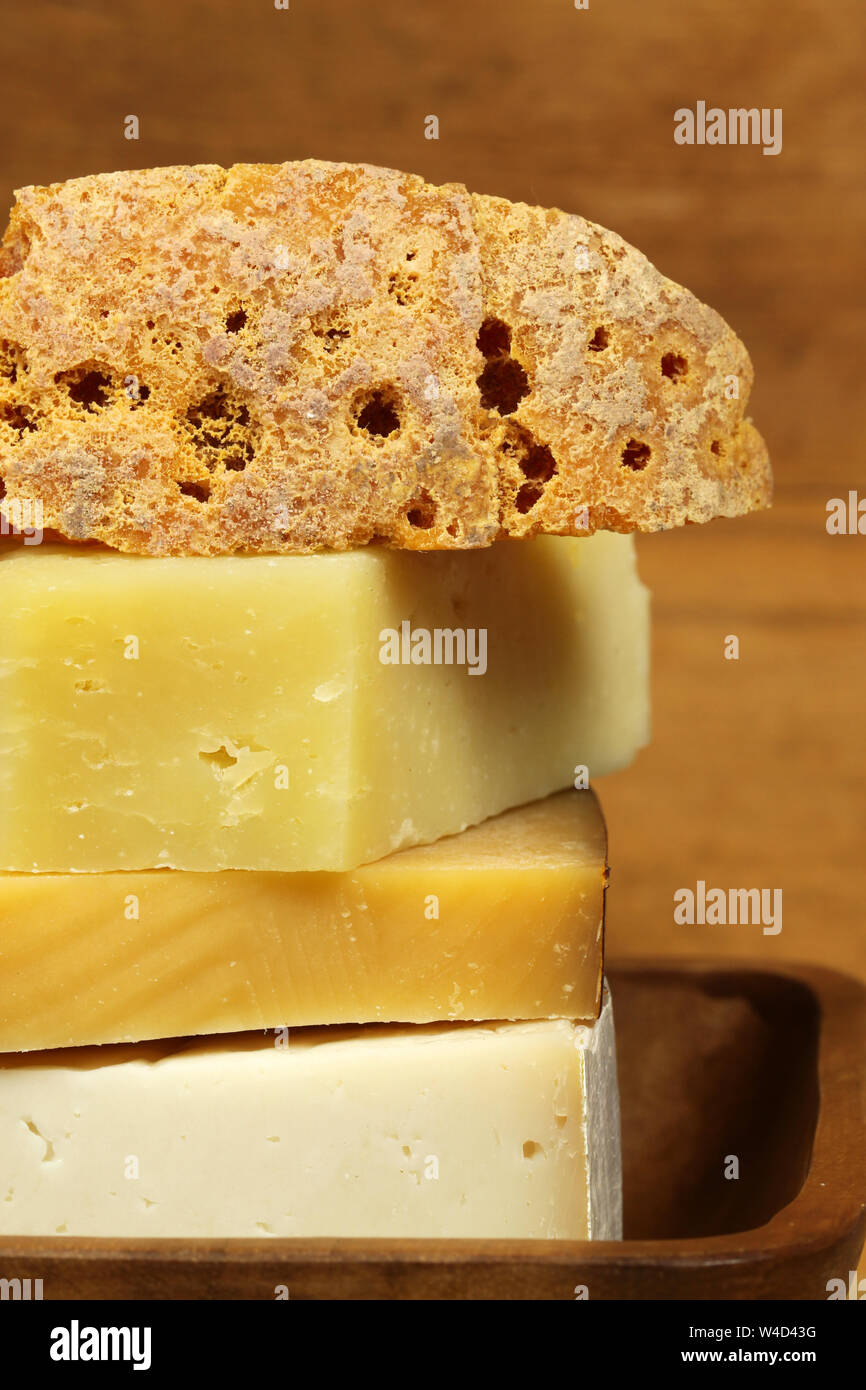 Closeup of old cheese. Stack arranged Stock Photo - Alamy