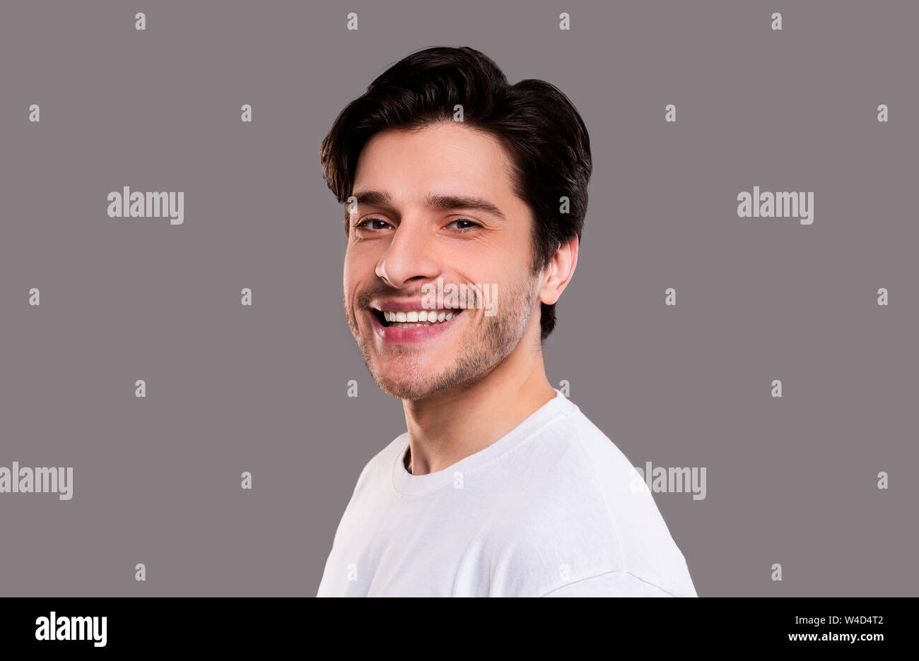 Friendly guy widely smiling at camera, semi half portrait Stock Photo ...