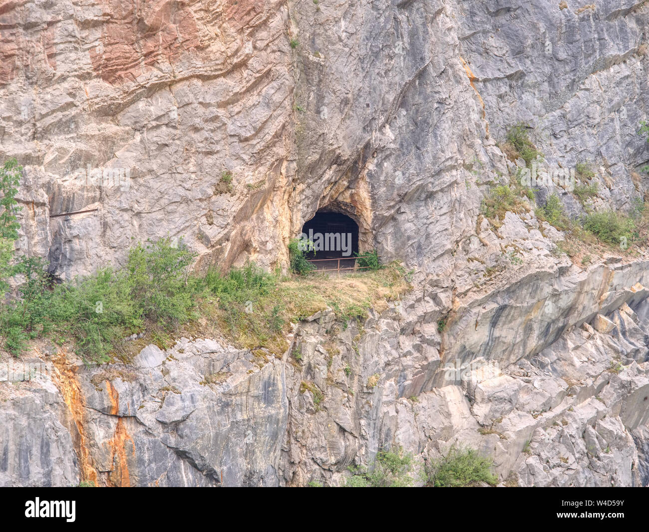 Adit in old abandoned limestone quarry Velka Amerika. Medieval tunnel ...