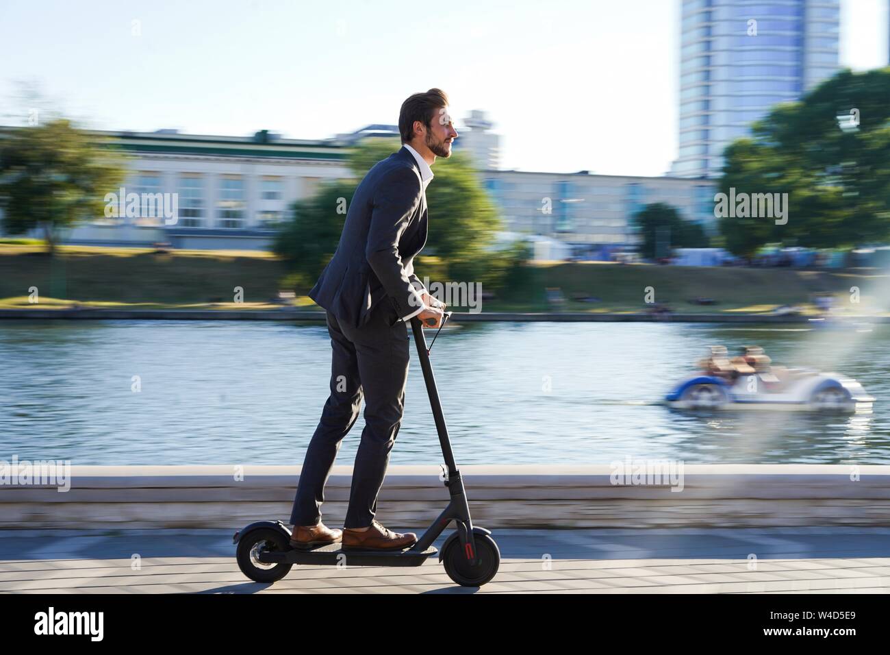 Man on electric scooter hi-res stock photography and images - Alamy